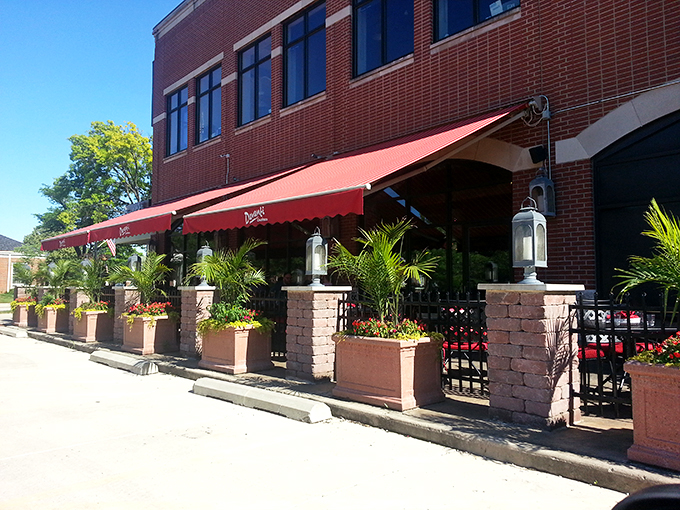 Red awnings and outdoor seating beckon you to pause your city stroll for a delicious detour into Italian culinary bliss.