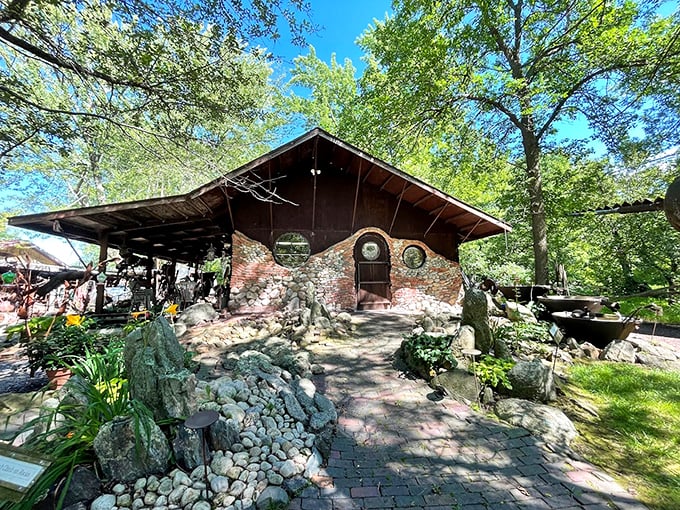 What an intriguing stone building! You can discover a unique world of recycled metal art and whimsy at Jurustic Park.