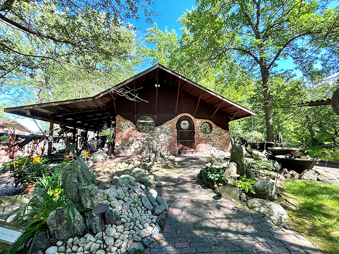 What an intriguing stone building! You can discover a unique world of recycled metal art and whimsy at Jurustic Park.