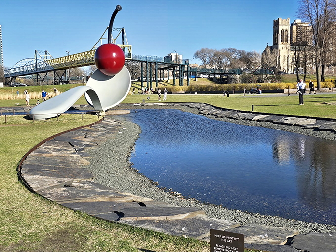 Who says you can't play with your food? This cherry-topped spoon proves that art can be both monumental and deliciously whimsical.