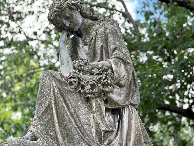 Looks like someone ordered their statue with extra drama. That's not a tear—it's just the rain… probably.