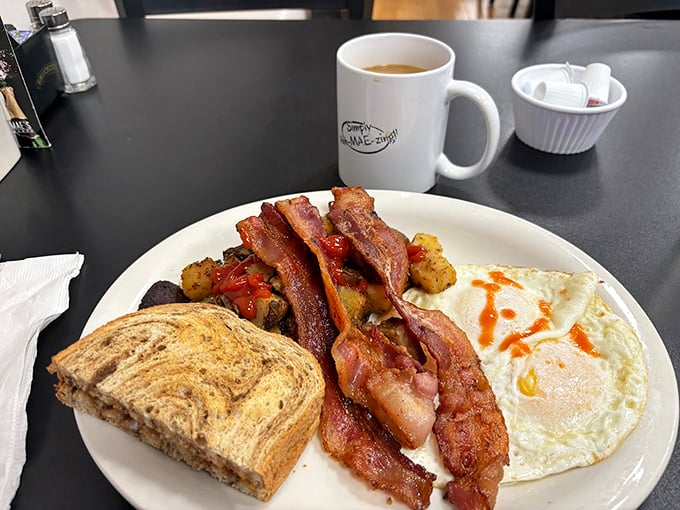 Bacon so crispy it could star in its own ASMR video. Eggs sunny-side up, bringing a ray of sunshine to your plate.