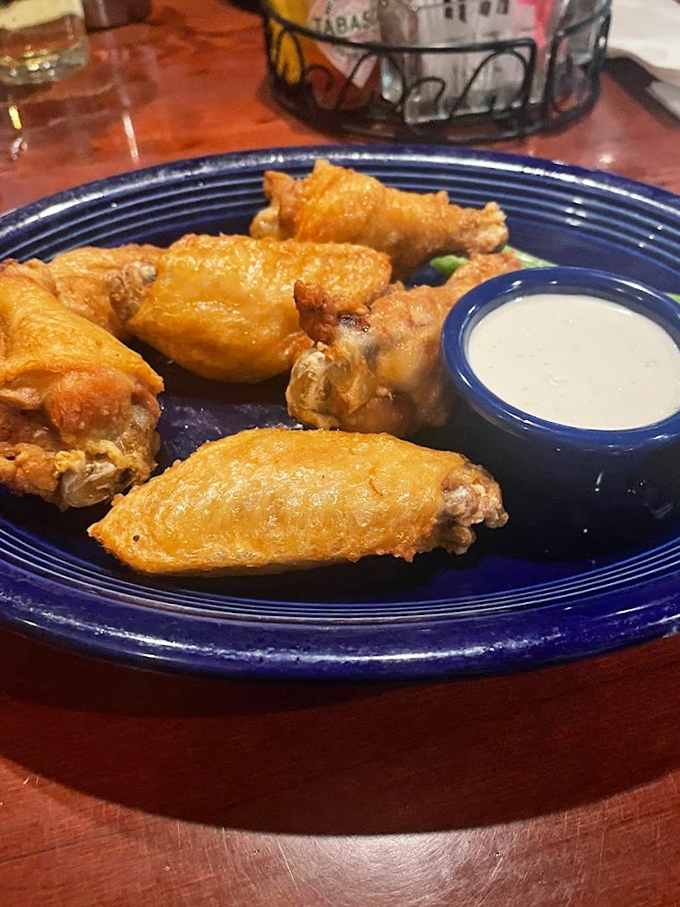Wing perfection achieved! These golden-brown beauties are the Mona Lisa of bar food &ndash; mysterious, alluring, and absolutely irresistible.