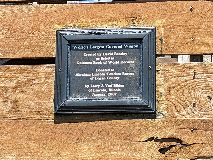 "The birth certificate of a gentle giant." This plaque tells the tale of how one man's dream became a roadside colossus. It's like "Extreme Makeover: Covered Wagon Edition."