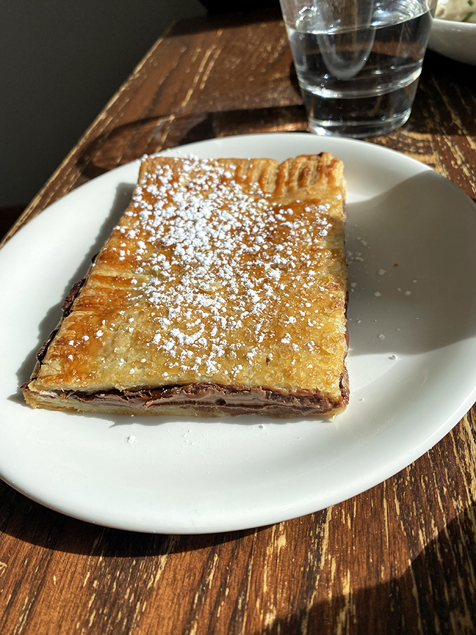 Pop Tart perfection! This isn't your average breakfast pastry &ndash; it's a flaky, powdered-sugar-dusted dream come true.