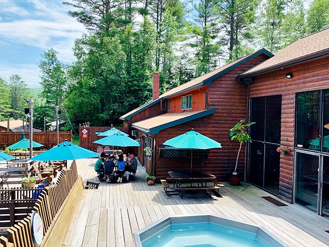 Deck-side dreaming: Where conversations flow as freely as the nearby river, and laughter echoes through the pines.