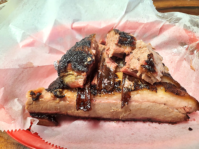 Behold, the brisket of champions! Each slice is a smoky, tender masterpiece that'll make your taste buds sing.