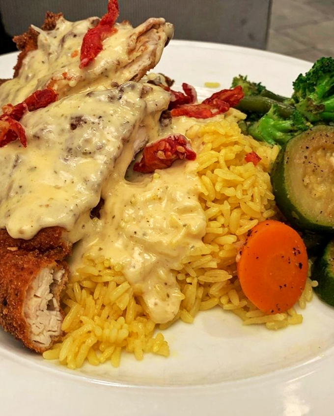 Golden-crusted chicken nestled against saffron rice, draped in velvety mushroom sauce&mdash;comfort food that dresses up for a night out.