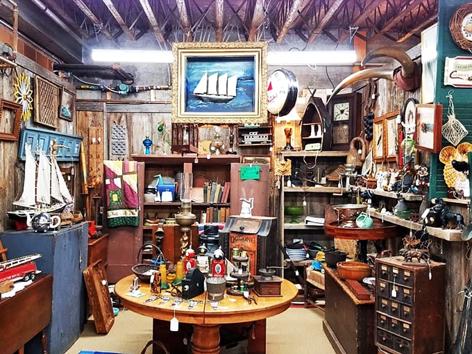 Nautical treasures and weathered wood create a cozy corner that feels like stepping into an old sea captain's study.