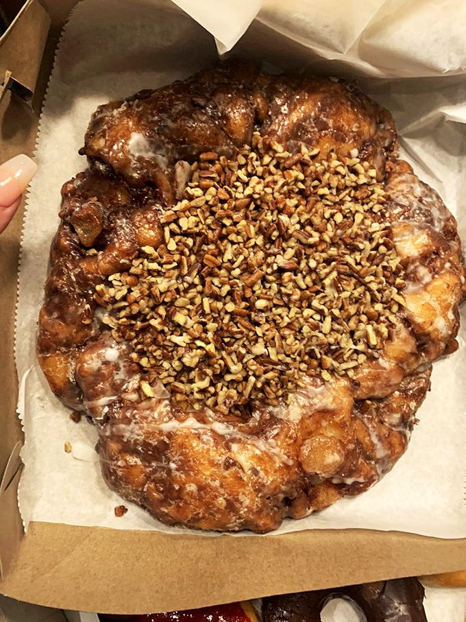 Meet the heavyweight champion of apple fritters, where every pecan-studded bite tells a story of perfect pastry craftsmanship.