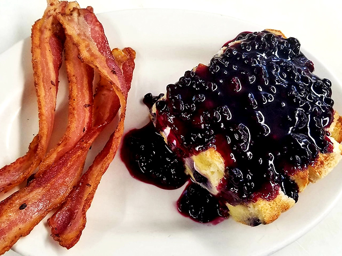 This isn't just breakfast, it's a berry bonanza! Blueberry French toast that's so good, you'll forget about your phone for a whole meal. 