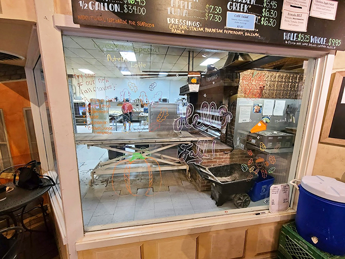 Peek behind the curtain of deliciousness! This window offers a tantalizing glimpse into the magical realm where Klinger's treats are born.