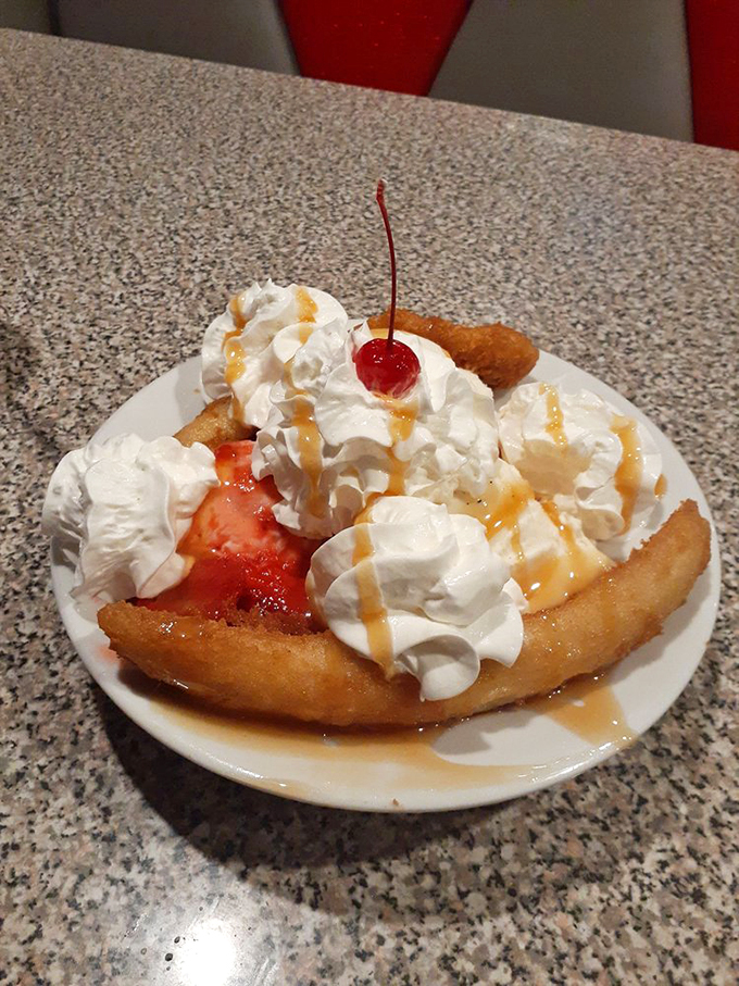 This isn't just dessert &ndash; it's a tower of whipped cream dreams crowned with cherries and drizzled with pure happiness. Photo credit: Rachelle E.