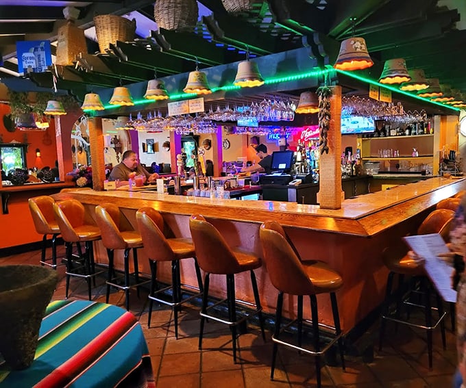 Where margaritas meet mood lighting&mdash;the bar's amber glow and woven basket lamps set the stage for evening magic.