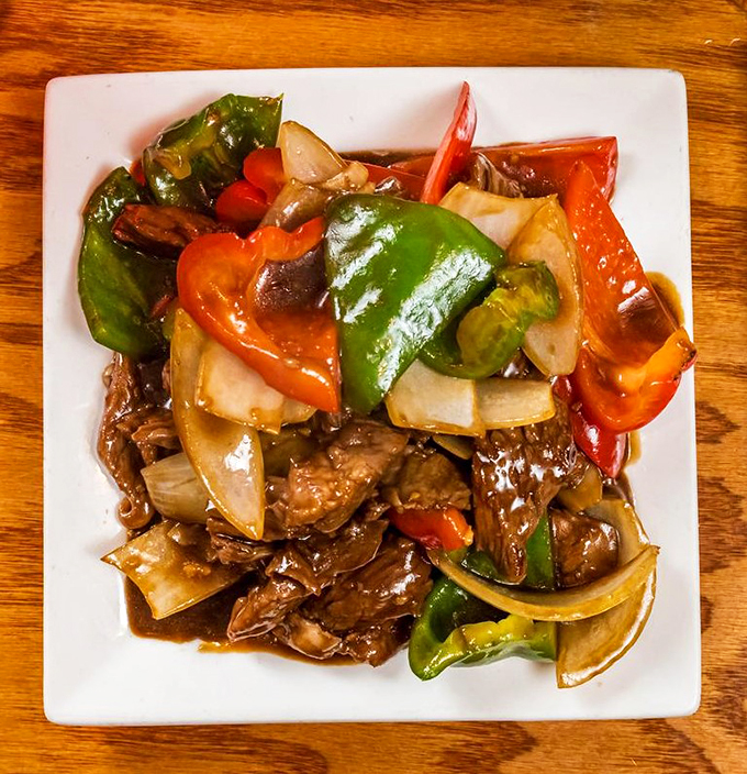 Glistening beef and crisp vegetables perform a perfectly choreographed dance in a sauce that's pure kitchen magic.