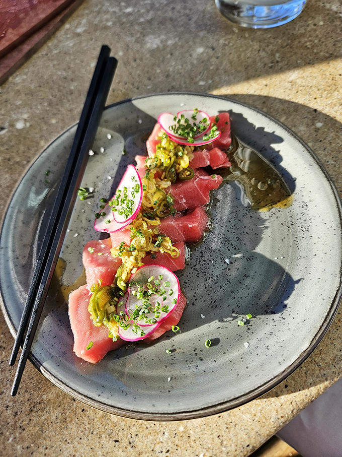 Behold the bluefin tuna, the Rolls-Royce of the sea! Delicately sliced and artfully presented, it's a dish that would make Poseidon himself jealous.