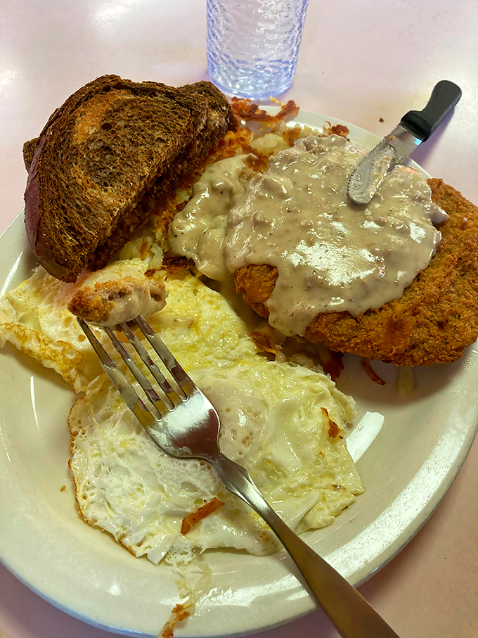 Holy gravy, Batman! This country fried steak isn't just a meal, it's a comfort food superhero ready to save your day from hunger.