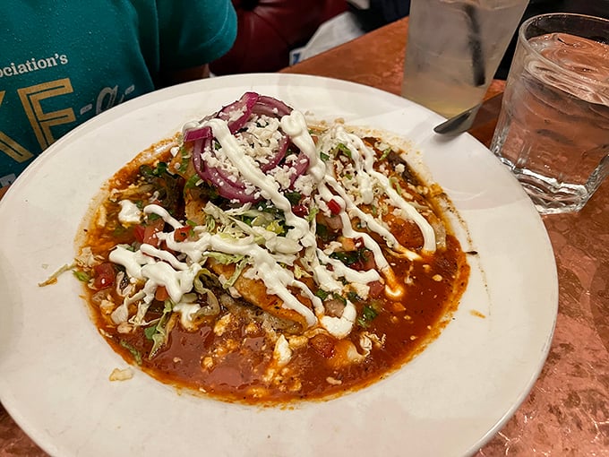 Brisket enchiladas that could make a vegetarian weep. Topped with a dollop of cool crema, it's like a flavor fiesta in your mouth.