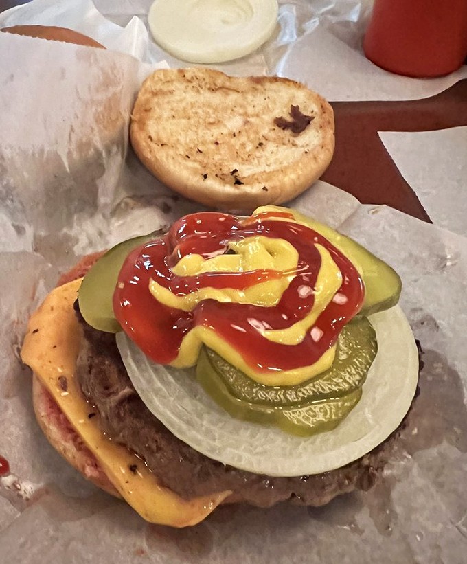 Fresh pickles, onions, and classic condiments dress up this beauty like jewelry on a queen who knows she doesn't need the extra attention.