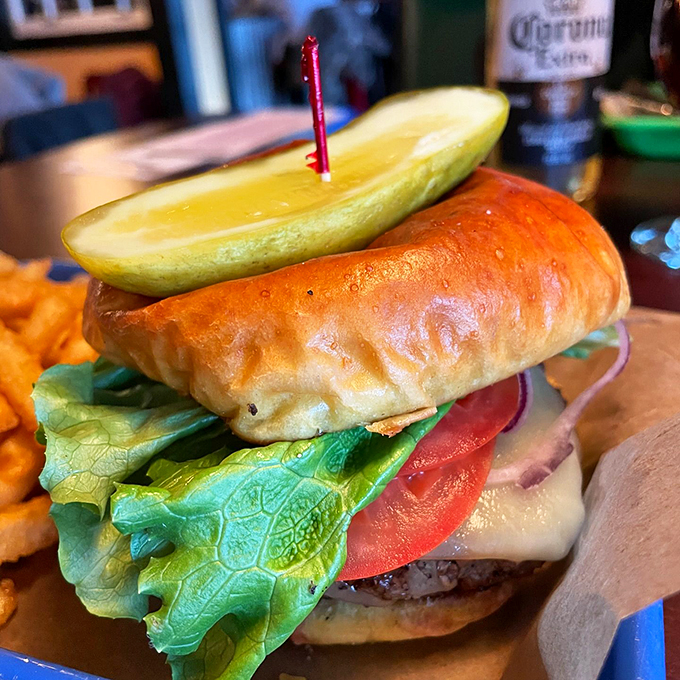 Fresh lettuce, ripe tomato, and a pickle spear standing guard - this burger means serious delicious business.