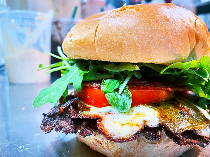 Fresh greens and ripe tomatoes add a garden-fresh crunch to this masterpiece. Mother Nature meets meat perfection.