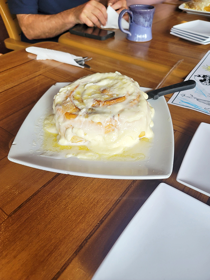 Holy sweet tooth, Batman! This cinnamon roll isn't just breakfast &ndash; it's a gooey, glazed work of art that belongs in the Louvre.