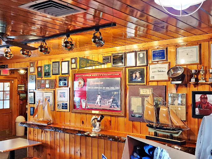 A wall of memories and maritime treasures tells the story of countless celebrations and championship seasons in this corner of coastal Maine.