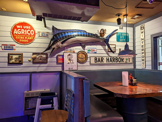 Nautical nostalgia meets coastal charm with vintage signs and a marlin that looks like it has some stories to tell. Photo credit: Junyan