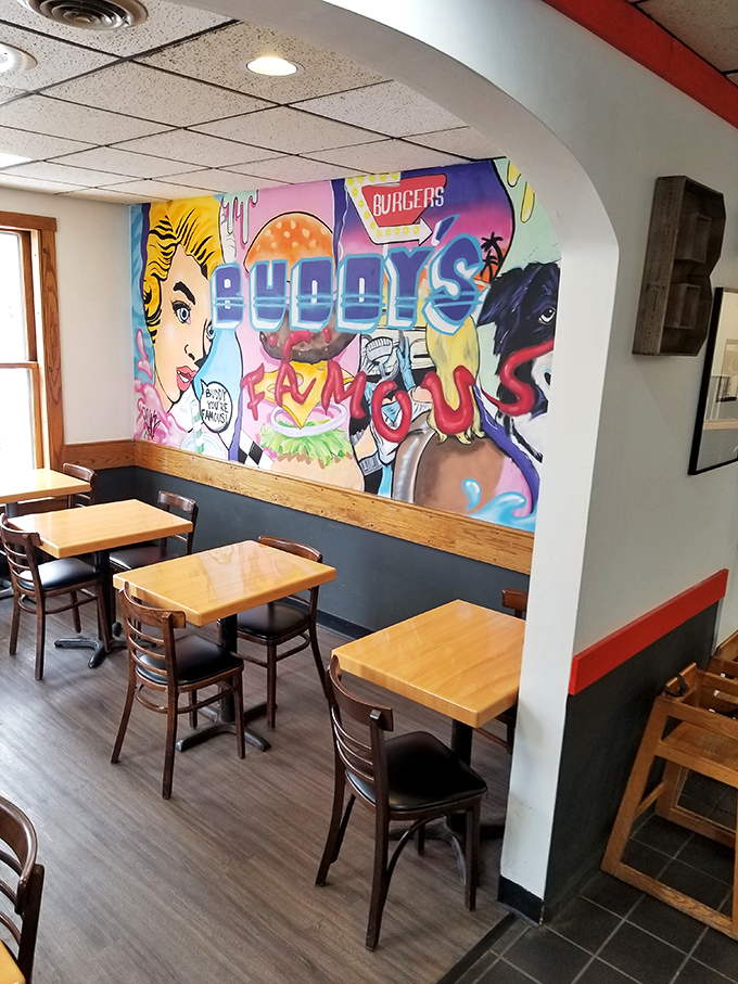 Local art meets comfort food vibes in this dining area, where a vibrant mural adds a splash of personality to every meal.