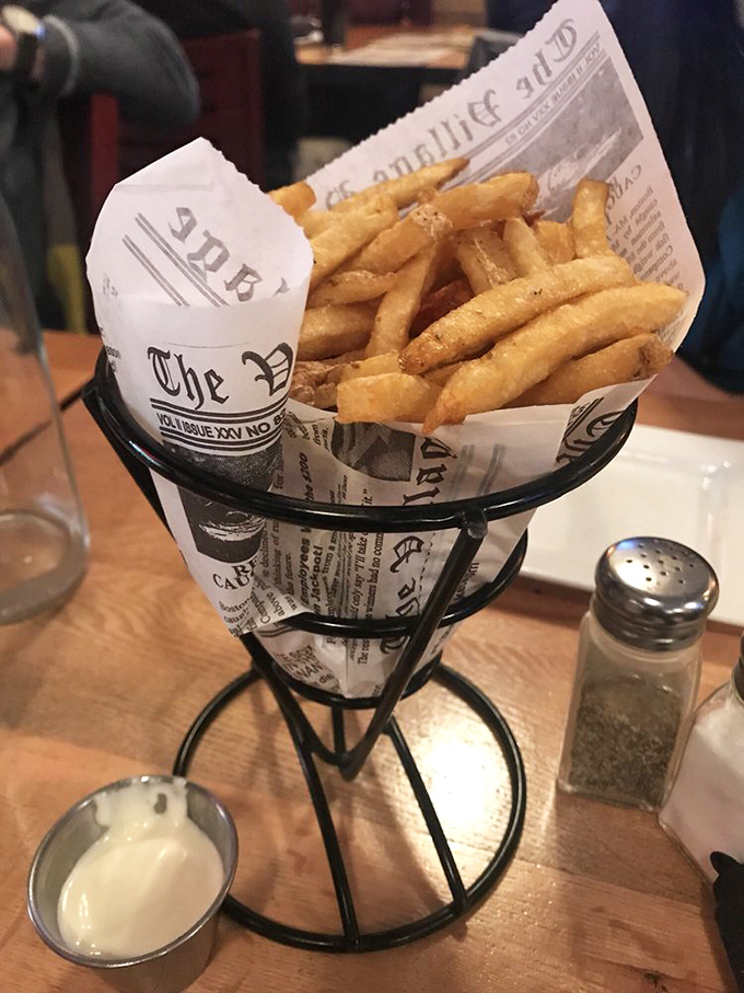 Golden, crispy duck fat fries arrive in their wire basket throne, ready to make regular fries question their life choices.