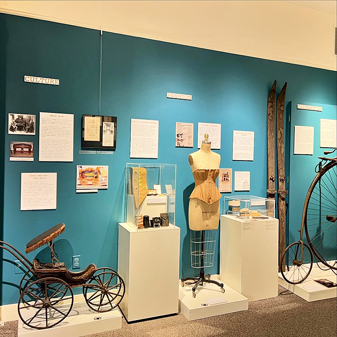 Culture meets fashion in this vibrant display, where vintage clothing and transportation artifacts tell tales of Vermont's past.