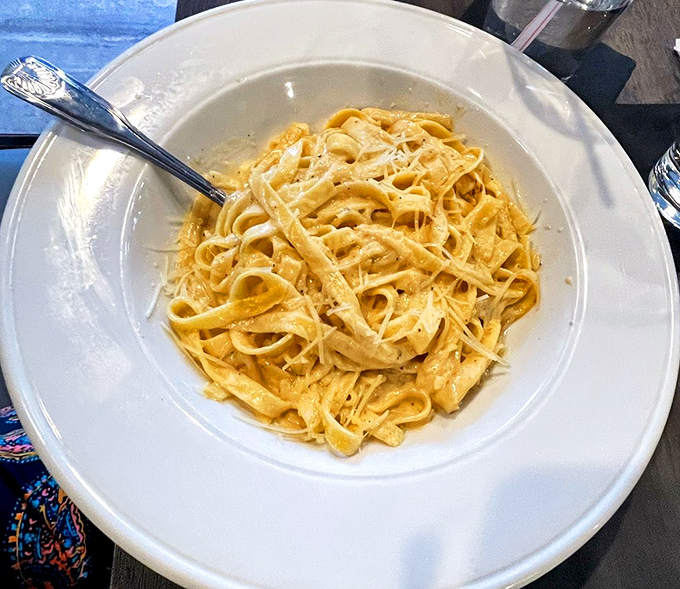 Silky ribbons of pasta swimming in a cream sauce that would make any Italian grandmother nod in approval.