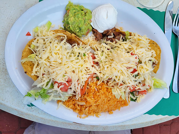 A complete fiesta on a plate - crispy tacos flanked by perfectly fluffy rice and creamy beans that'll make you forget about leftovers.