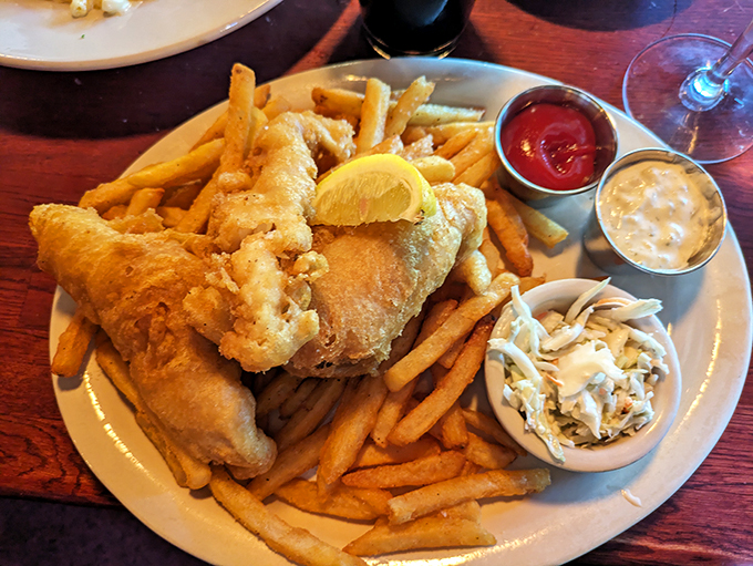 The fish and chips: a golden, crispy hug for your palate. These aren't just any old chips off the old dock &ndash; they're a first-class ticket to flavor town. Photo credit: Alyssa Coltrain