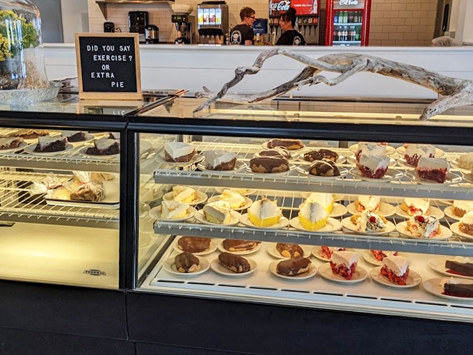 "Exercise or extra pie?" asks the cheeky sign above a display case that's basically heaven with a glass front.
