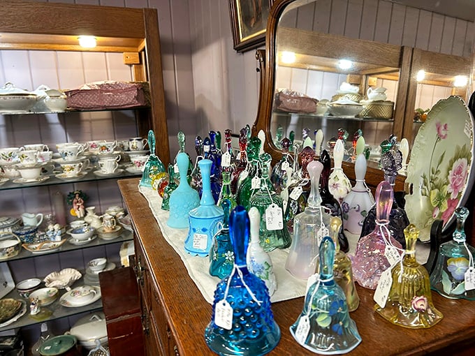 Like a rainbow caught in glass, these vintage bells and teacups tell stories of elegant afternoons and cherished family gatherings. Photo credit: Fairfield Antique Mall