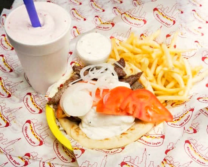 A perfect marriage of crispy fries and a generously stuffed gyro, with tzatziki sauce dripping just the right amount.