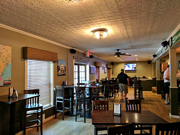 Warm wood tones and pressed tin ceilings create an atmosphere that feels like a warm hug from your favorite aunt's dining room.