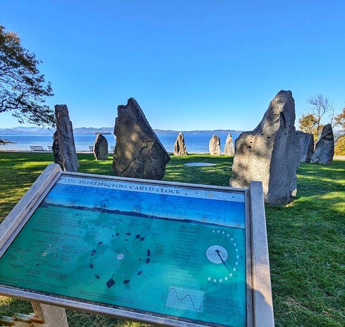 The Earth Clock's stones stand sentinel at sunset, creating a breathtaking silhouette against Lake Champlain's shimmering waters.