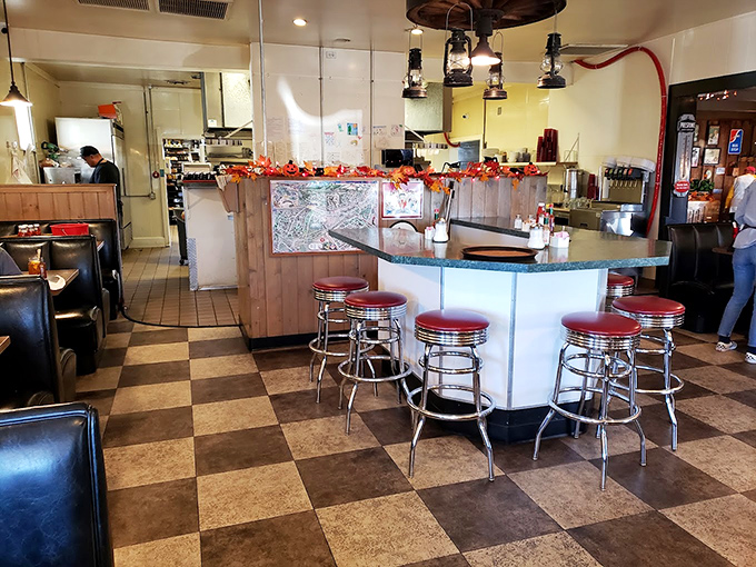 Checkered floors and chrome stools - it's not just a diner, it's a time machine with a side of coffee.