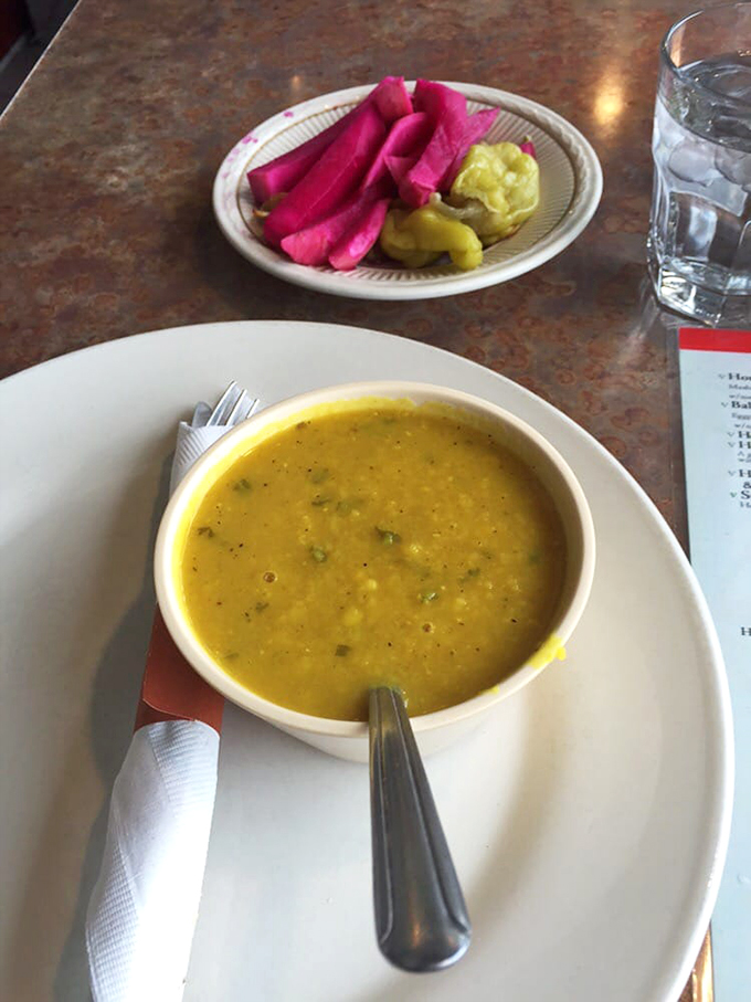 A perfect pairing: vibrant pink pickled turnips add zip to the velvety lentil soup, creating a dance of flavors.