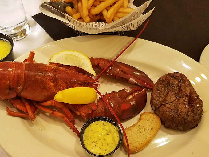 The surf meets turf in spectacular fashion - a perfectly steamed lobster shares the spotlight with a juicy steak.