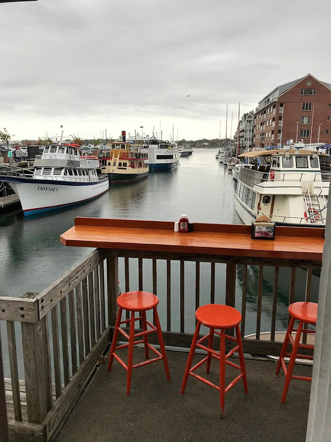 The outdoor bar beckons with promises of cold brews and fresh catches, while boats drift by like nature's dinner theater.