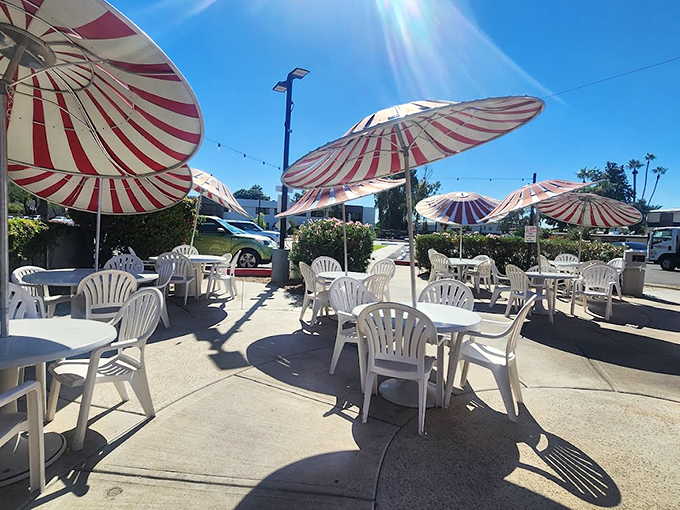 When Arizona sunshine calls, these candy-striped umbrellas create an oasis of shade for outdoor dining enthusiasts. Photo credit: krystal mendez