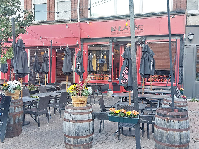 Rustic wine barrels and colorful flower boxes transform this sidewalk space into an urban oasis. Perfect for people-watching while sipping local brews.