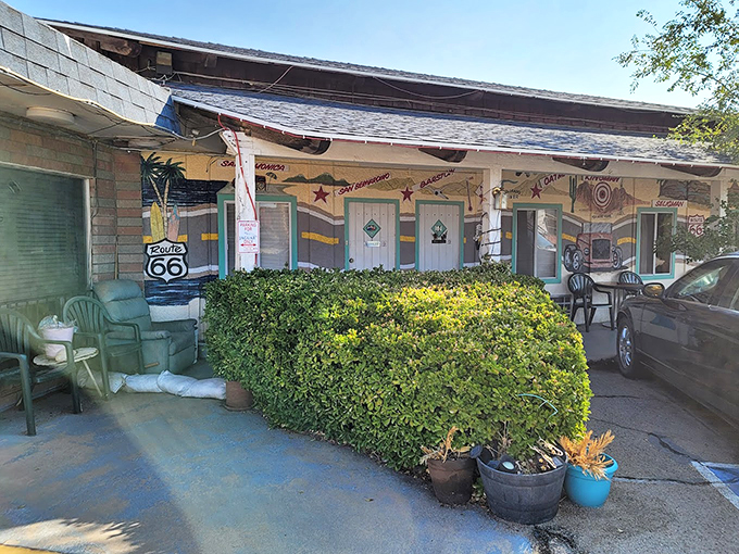 Retro charm meets desert beauty. El Trovatore's exterior is a colorful canvas of Route 66 history, with each door promising a unique adventure.