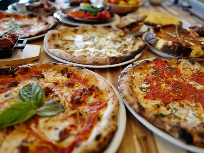 Wood-fired perfection meets artisanal flair. These Neapolitan-style pies showcase the beautiful marriage of crispy crust and melty magnificence.