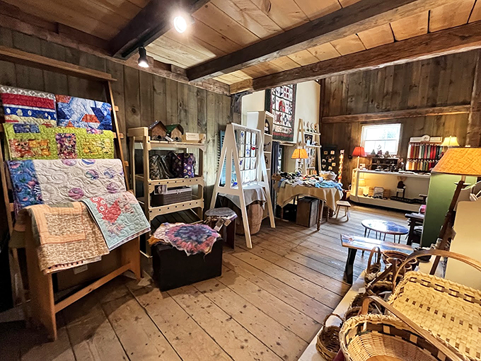 Pine floors and wooden beams frame an artisan's paradise, where quilts tell stories of Vermont winters and creative spirits.