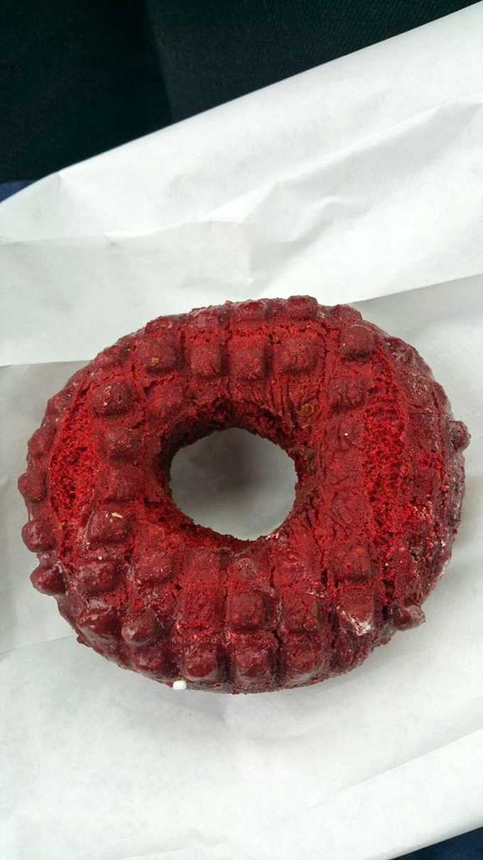 Holy crimson confection! This red velvet donut looks like it's ready for its superhero origin story.