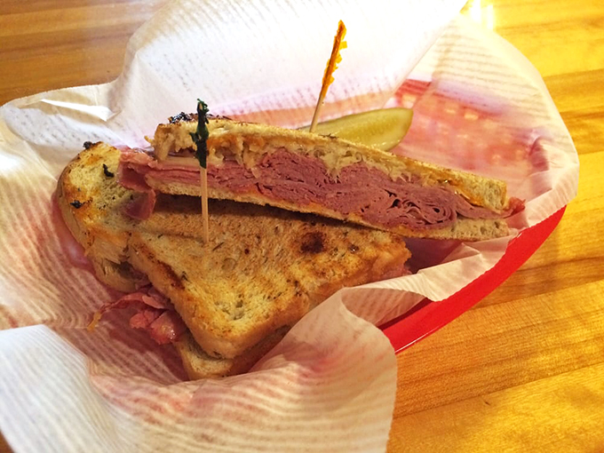 This isn't just a sandwich - it's edible architecture, with layers of perfectly stacked meats and fresh toppings.